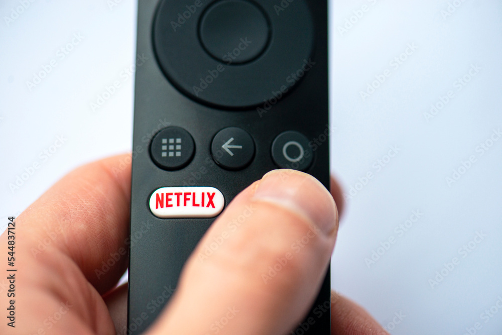 BERLIN - NOV 10: Close-up of button with Netflix logotype on a TV ...
