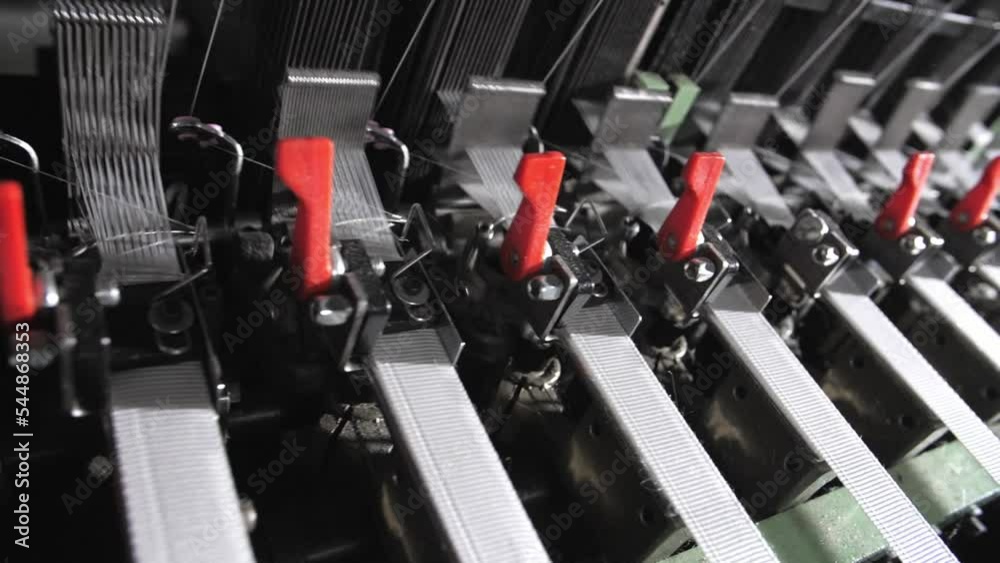 Close up of textile machine in slow motion. Fibre thread lines on the ...