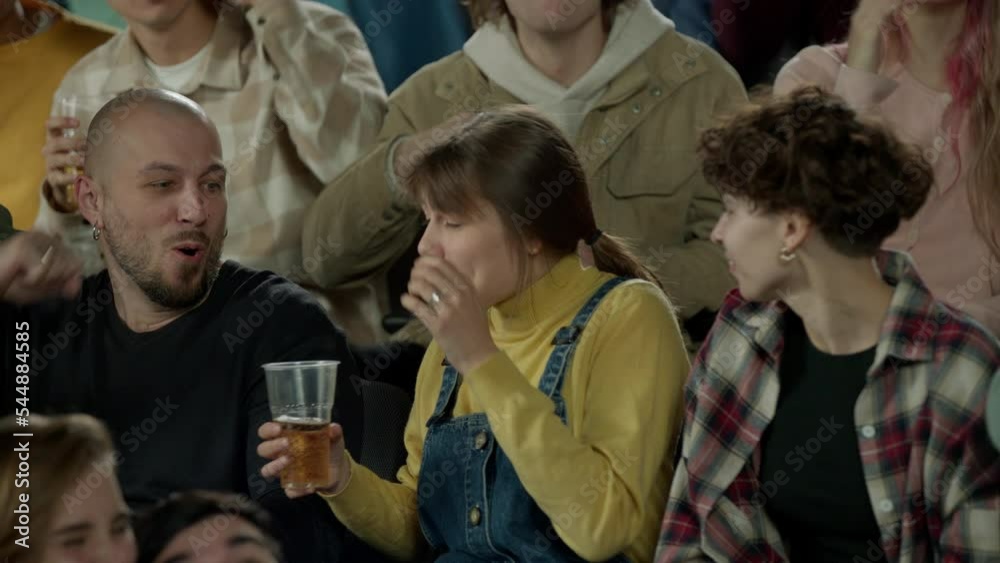 Funny stadium kisscam moment - crowd. Television like camera zoom. Fans ...