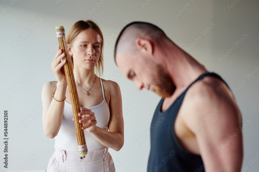 Practice of standing on nails. Couple of people meditation while ...