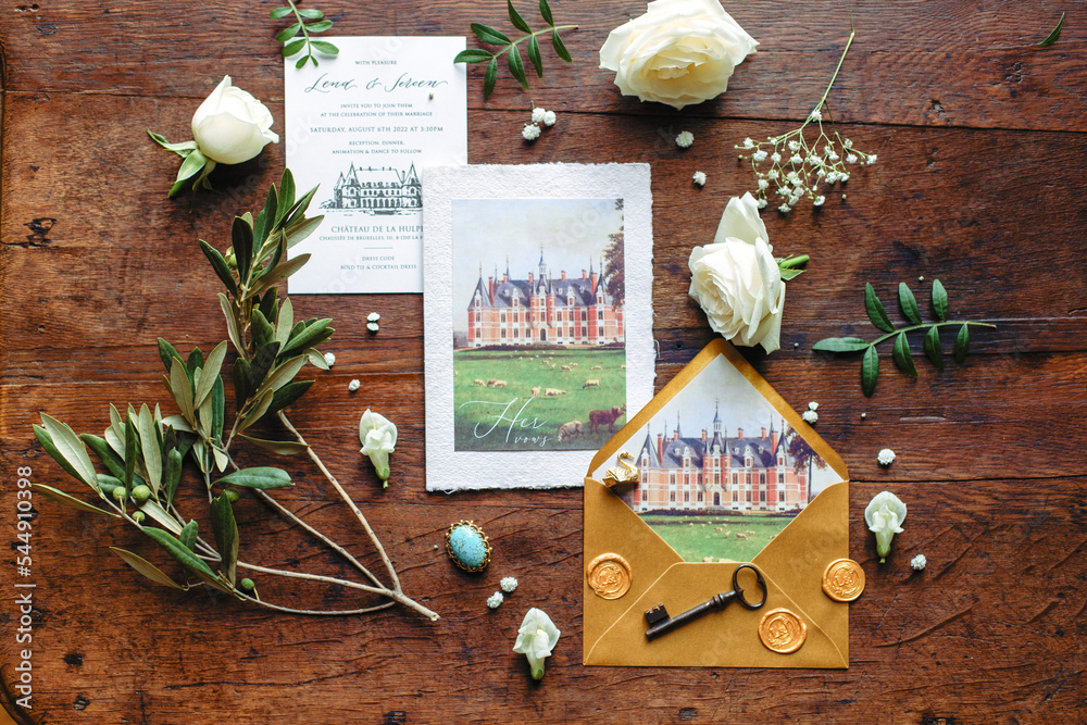 Above view of invitation envelope with letters and painting of vintage ...