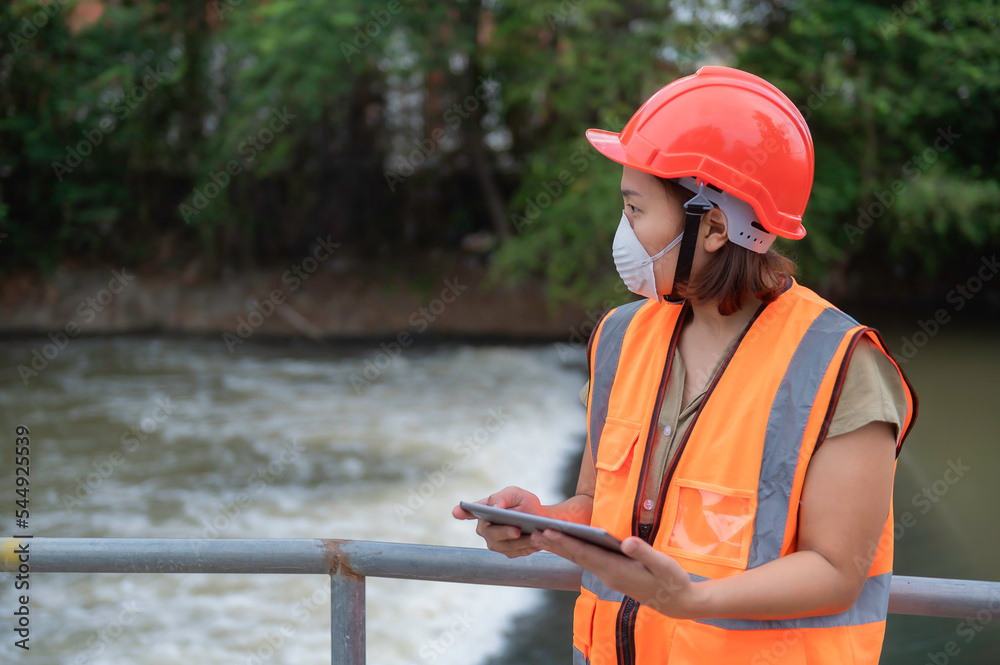 Asian Female engineering working . at sewage treatment plant,Marine ...