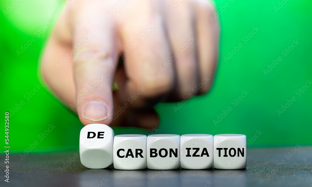 Dice form the word decarbonization. Symbol to reduce carbon dioxide ...