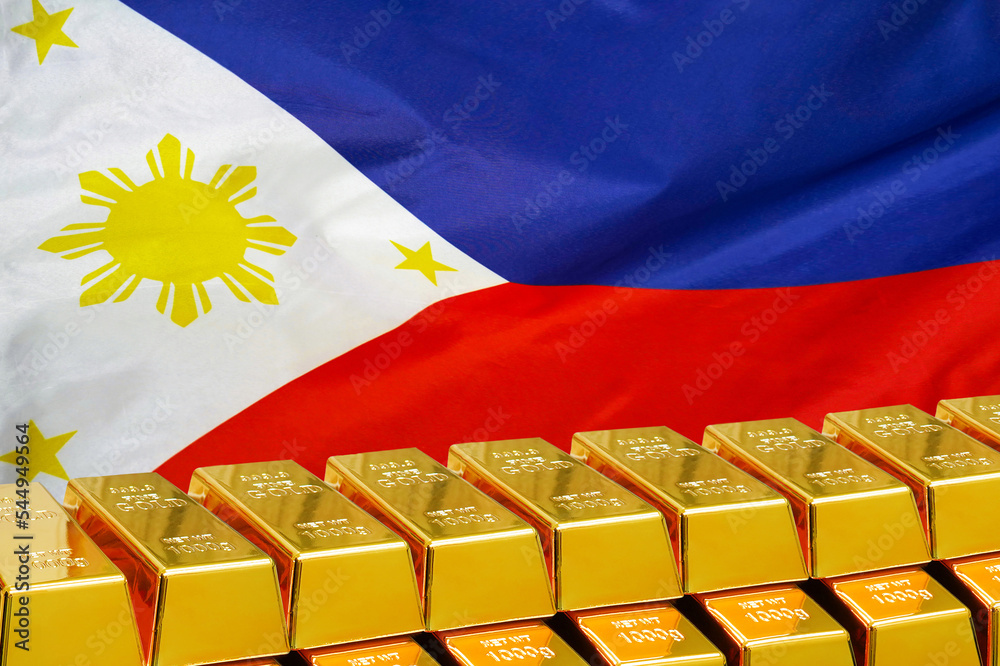 Row of shining golden bullions on the Philippines flag background ...
