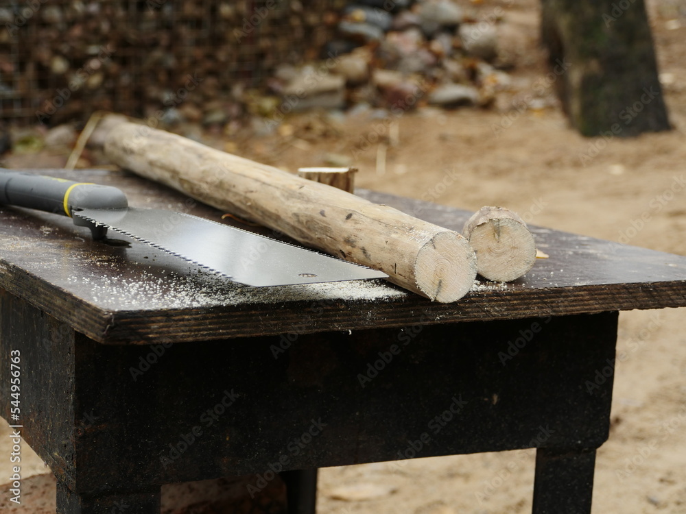 sharp hand saw hacksaw and wood blank on workbench Stock Photo | Adobe ...