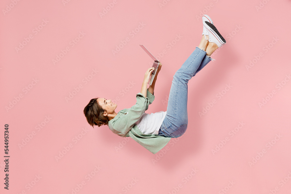 Full size side view young happy IT woman she wear green shirt white t ...