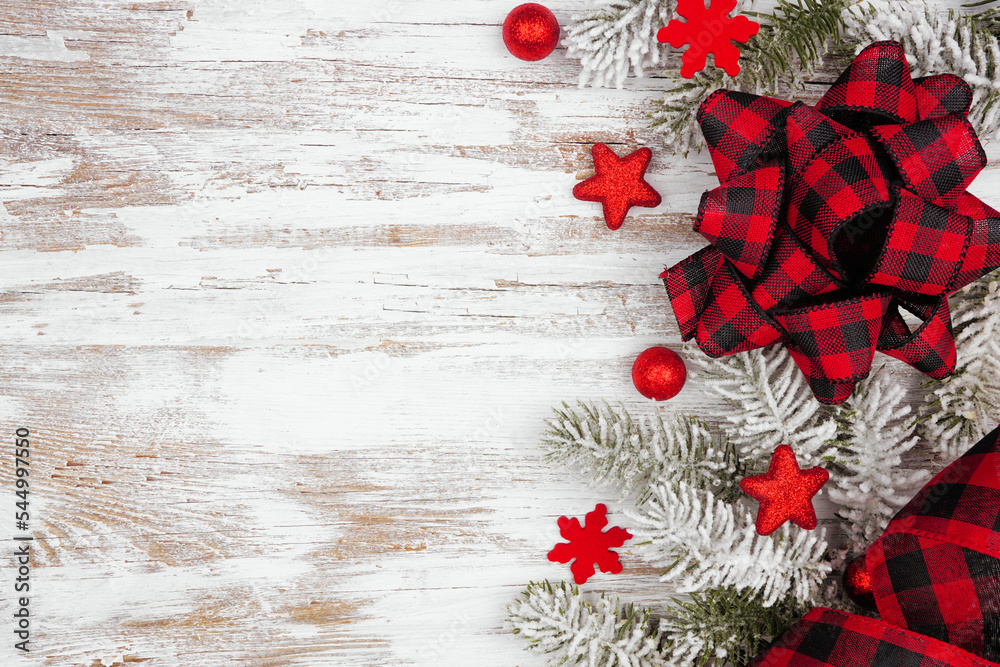 Christmas side border of red ornaments, snowy branches and red and ...