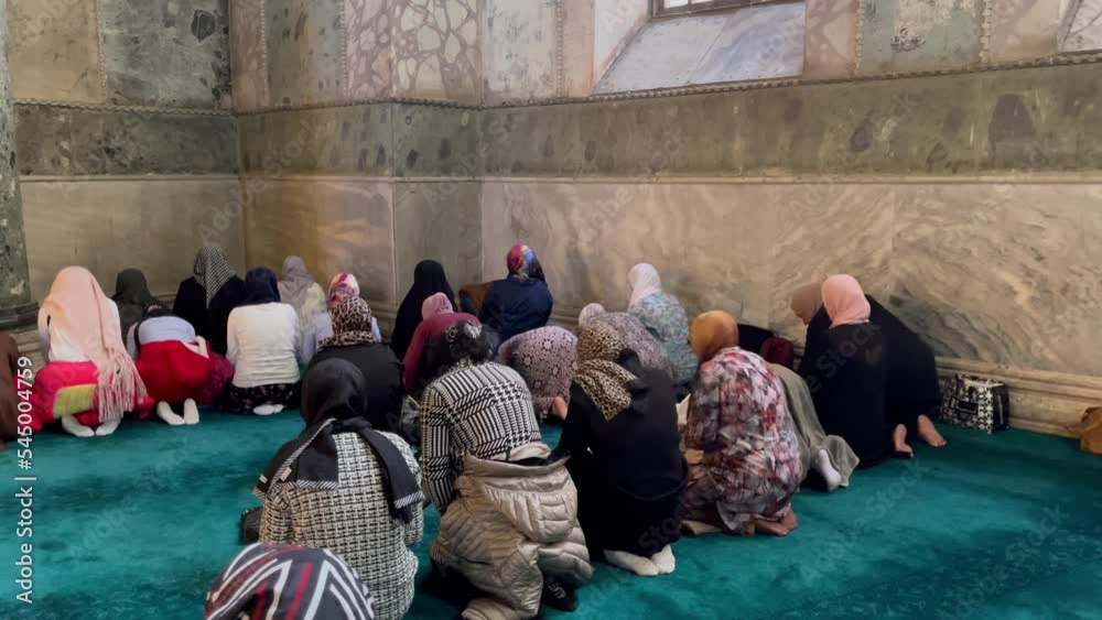 Anonymous muslim women praying on their knees inside Ayasofya mosque in ...