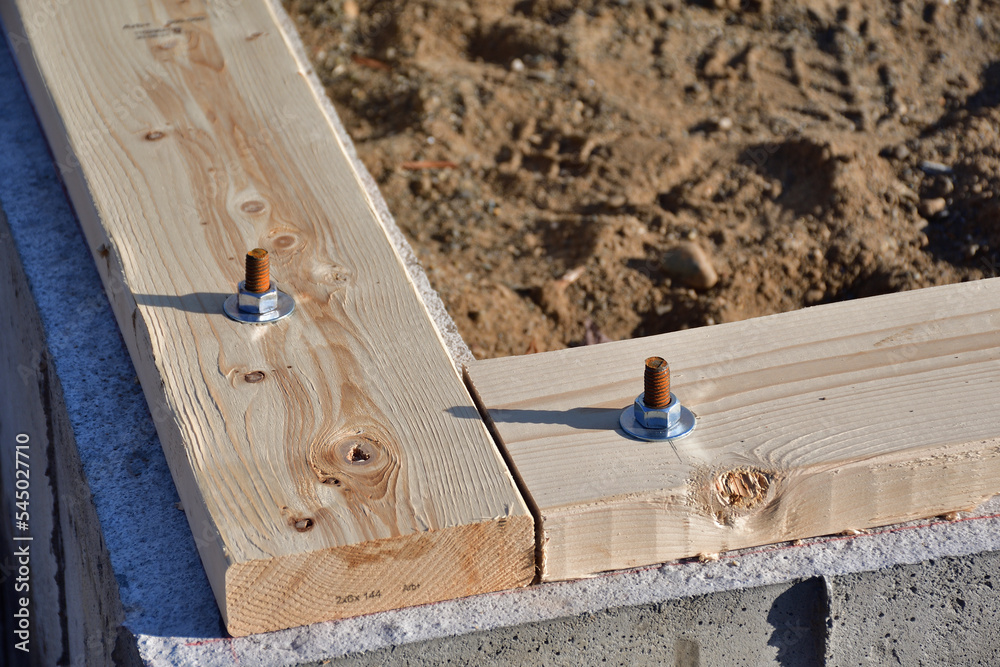 Sill plate on concrete foundation anchors. Threaded anchor to secure ...