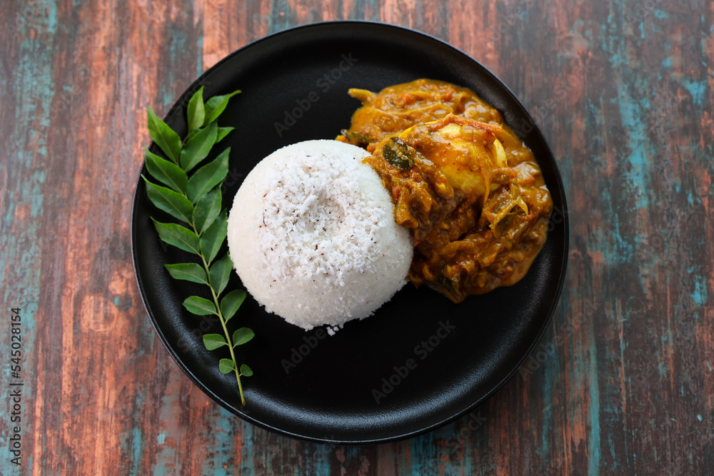 Rice Puttu or pittu steamed rice cake and egg roast curry popular in ...