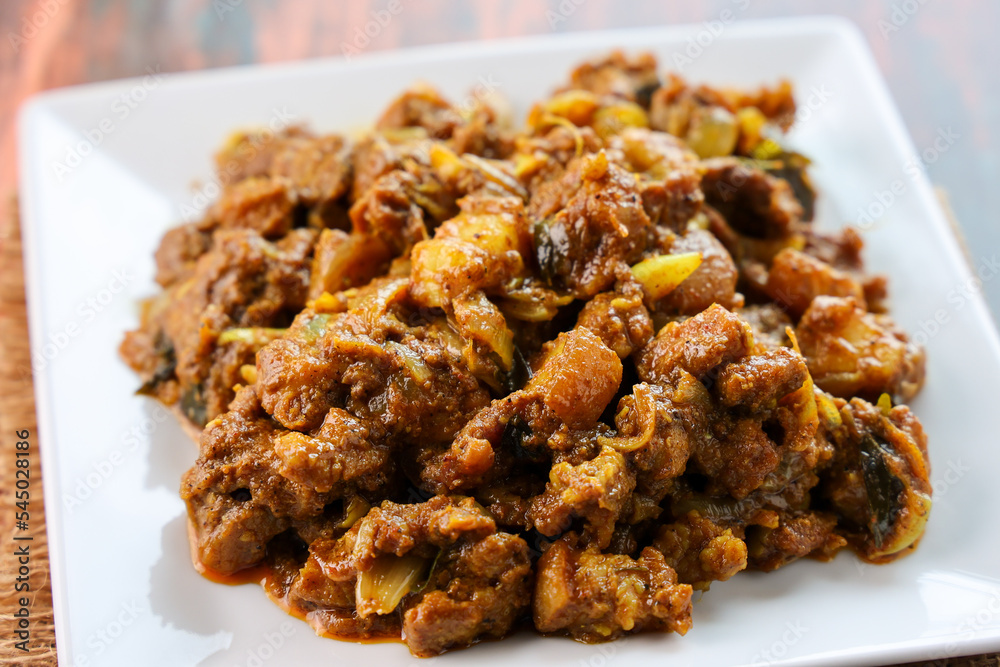 Spicy hot meat curry from Kerala India. Pork pig masala curry vindaloo ...