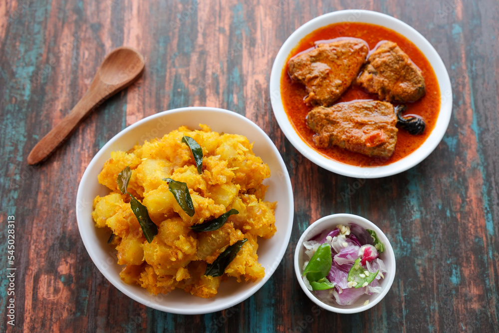 tapioca and spicy hot Kerala fish curry Indian food. Kappa king fish ...