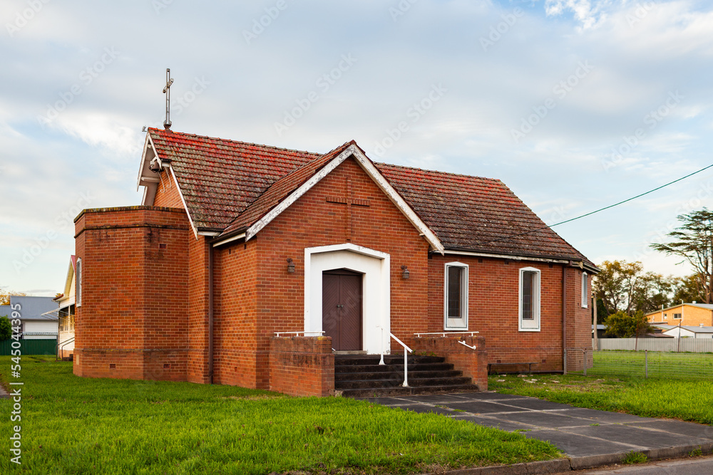 Brick church building at dusk with doors shut Stock Photo | Adobe Stock