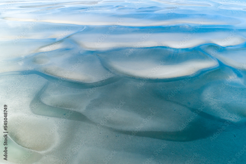 Aerial view of sandbar patterns in shallow blue water. Stock Photo ...