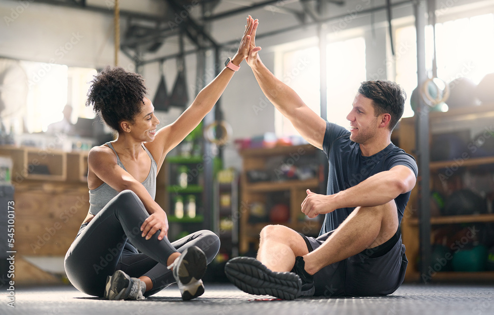 High five, motivation and fitness with a man and woman celebrating as a ...