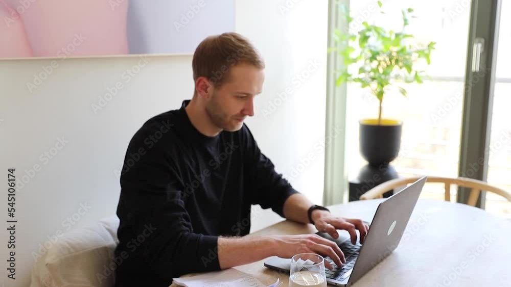 Young man working from home Stock Video | Adobe Stock
