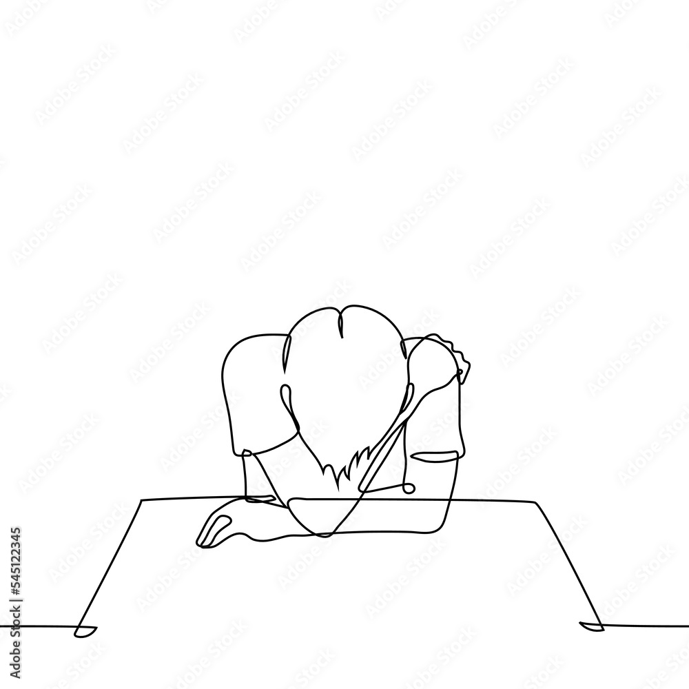 man lowered his head covering his face with his hand while sitting at ...