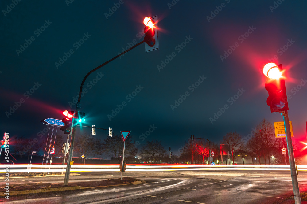 Traffic lights on a traffic junction in a rainy night Stock Photo ...