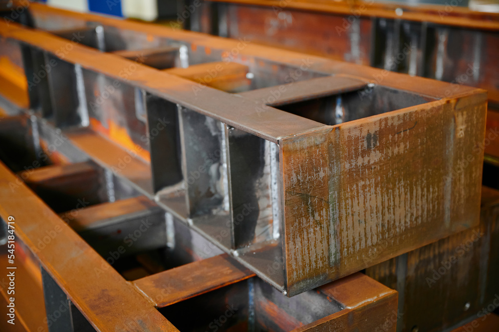 Welded fabrication made of beams stacked in plant warehouse Stock Photo ...