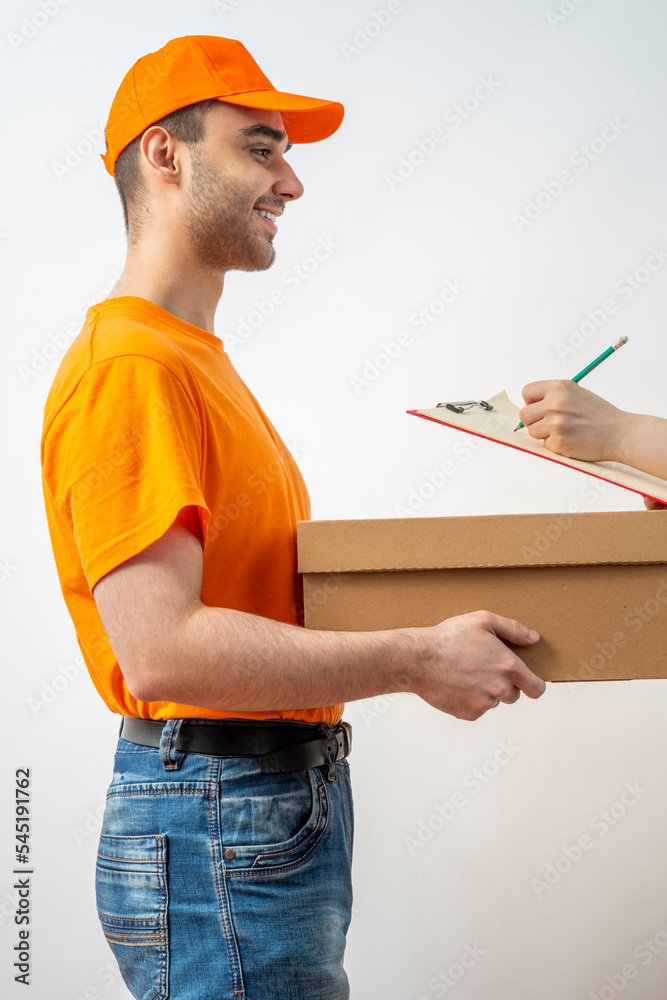 Delivery man with paper bag, clipboard. Courier in uniform cap and t ...