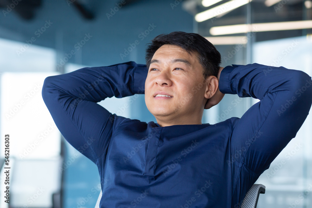 Happy businessman resting after successfully completed work asian man ...