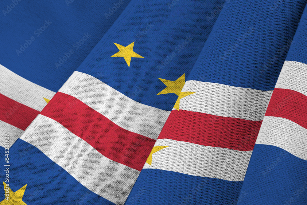 Cabo verde flag with big folds waving close up under the studio light ...