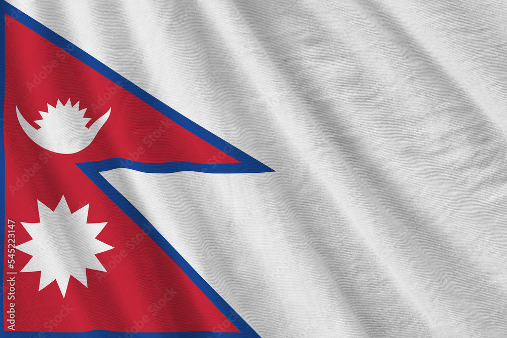 Nepal flag with big folds waving close up under the studio light ...