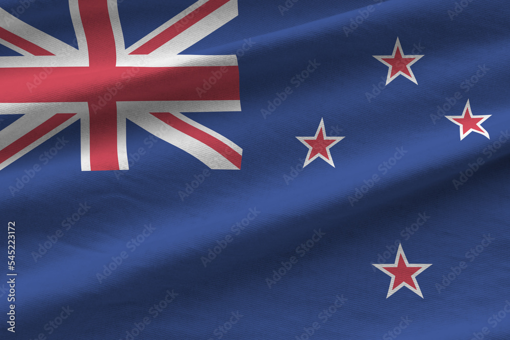 New Zealand flag with big folds waving close up under the studio light ...