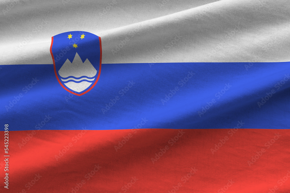 Slovenia flag with big folds waving close up under the studio light ...