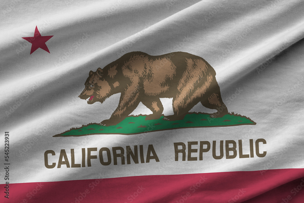 California US state flag with big folds waving close up under the ...