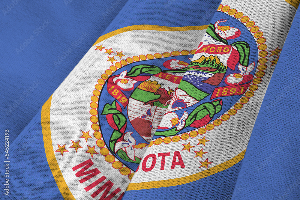 Minnesota US state flag with big folds waving close up under the studio ...