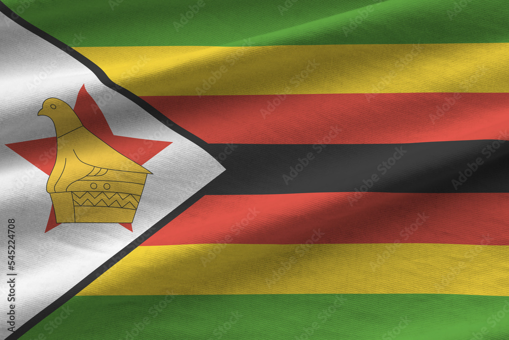 Zimbabwe flag with big folds waving close up under the studio light ...