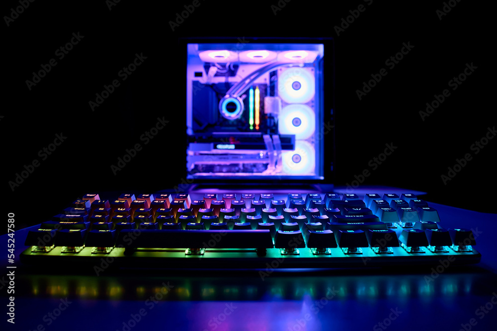 Foto de Gaming keyboard with RGB light and powerful gaming PC. Colorful ...