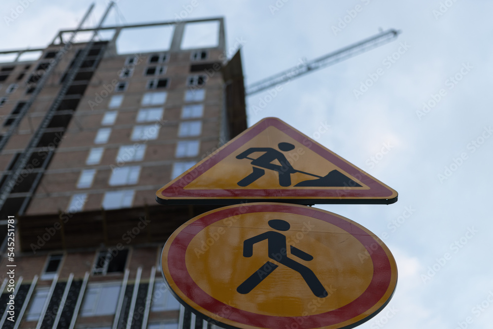 Work in progress. Roadworks, road signs. Men at work. Some signs ...