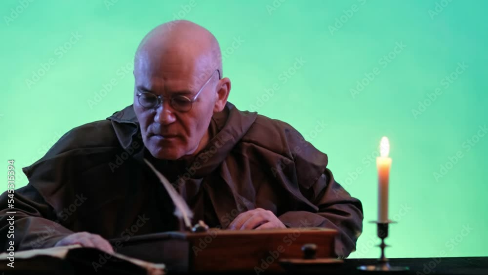 Video of old monk takes a manuscript out of the document box, signs it ...