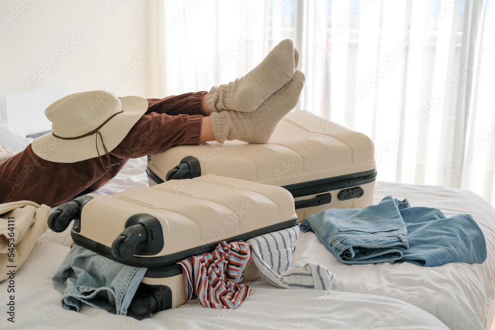 Travel.Suitcase.Girl traveler packing luggage in suitcase Travel ...