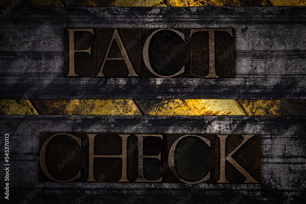 Fact Check text with on grunge textured copper and gold background ...