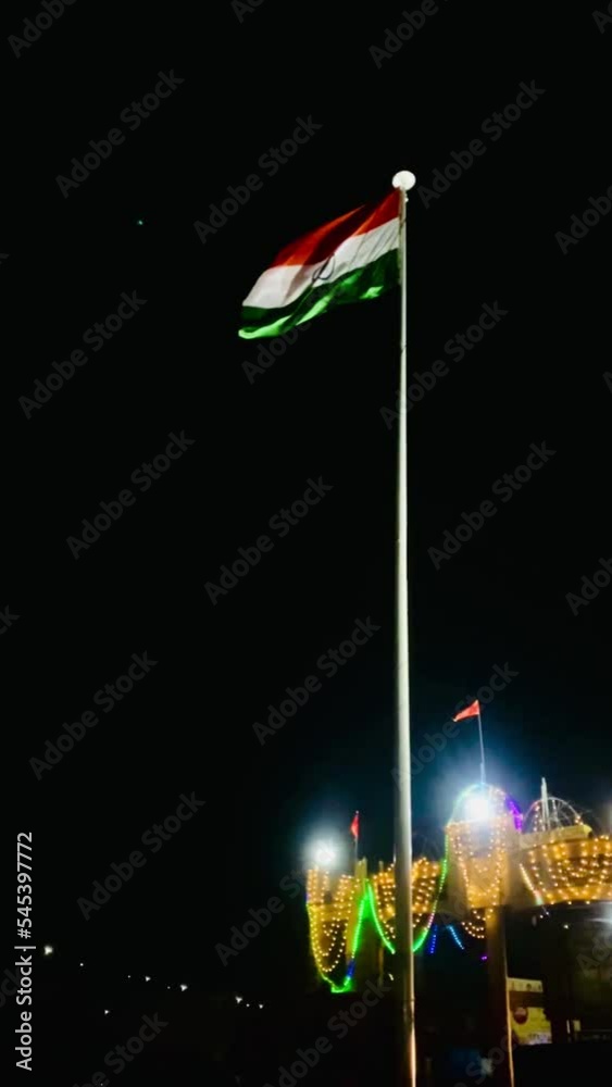 The Indian flag is proudly flying in the night sky, a symbol of ...