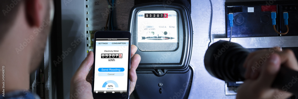 Man's Hand Holding Mobile Phone Showing Electric Meter Reading Stock ...