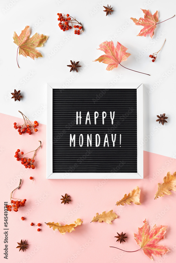 Foto de Happy Monday greeting text on text board. Autumn leaves, spices ...