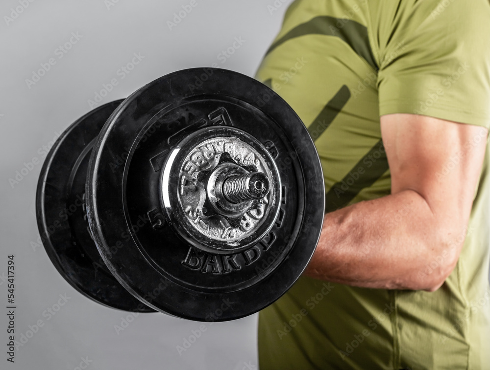 Hand lifting heavy dumbbell. Bodybuilder training biceps closeup Stock ...