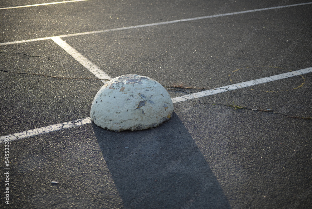 concrete traffic limiters concrete markers painted white, parking space ...