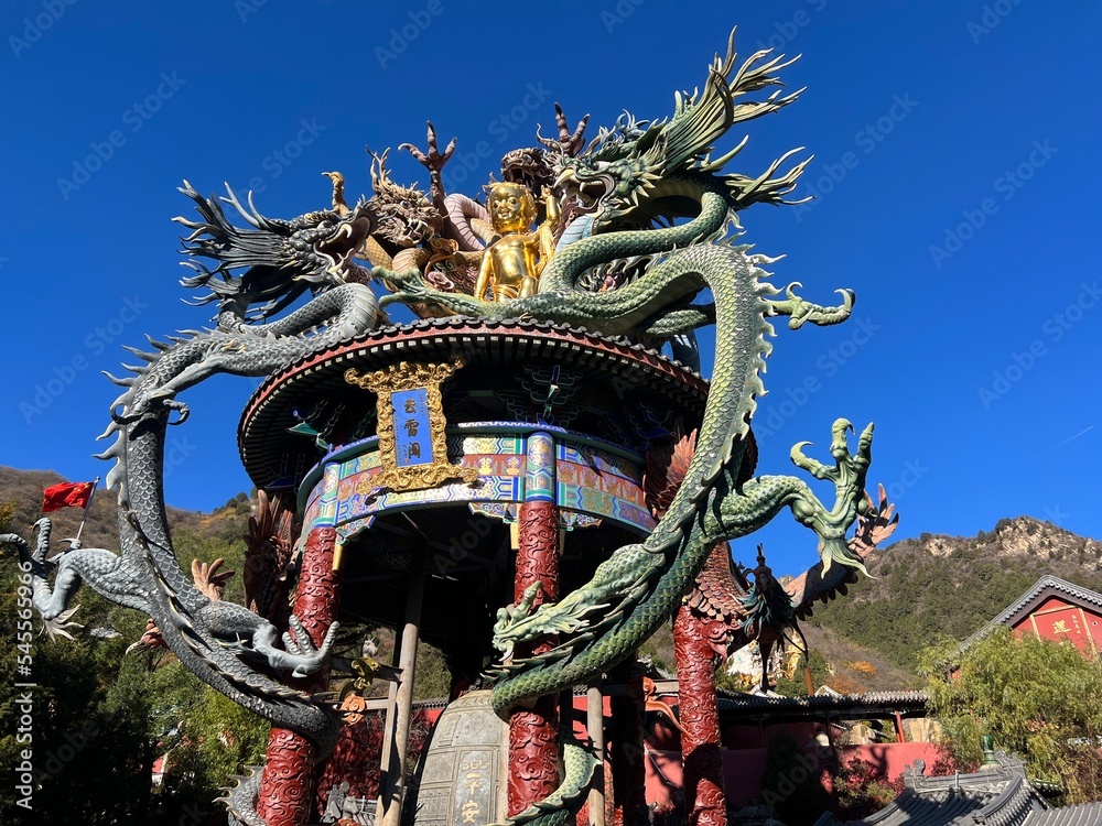 Baipu temple - detail from roof - small golden buddha with chinese ...
