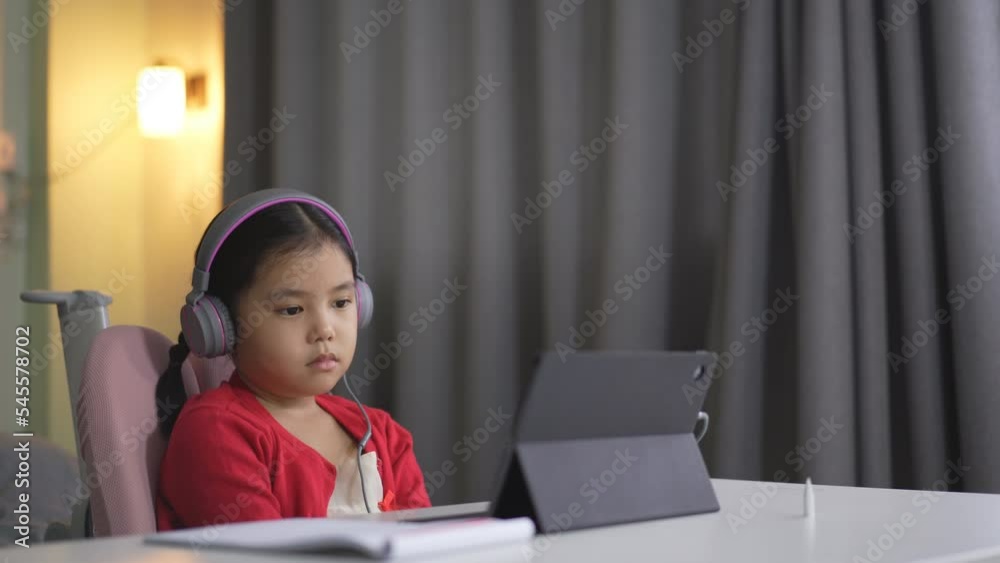 asian child learning on computer tablet or kid girl student back to ...