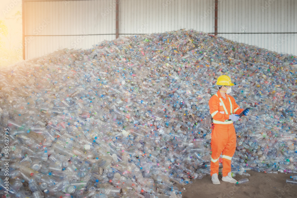 Workers in landfill dumping, Garbage engineer, recycling, wearing a ...