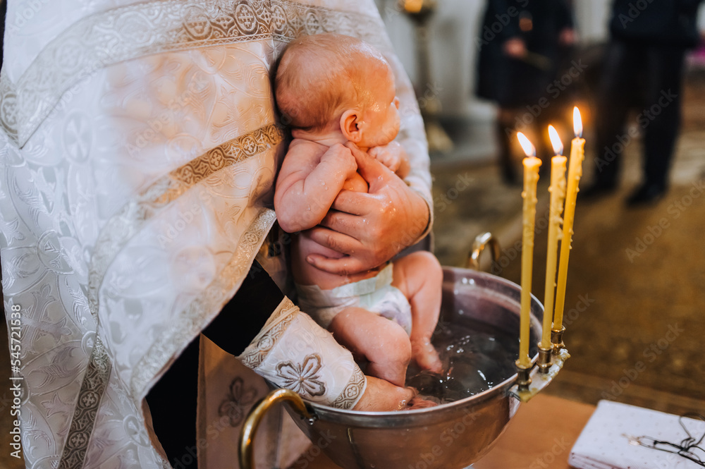 A male Christian priest in a church conducts a sacred rite, a ritual ...