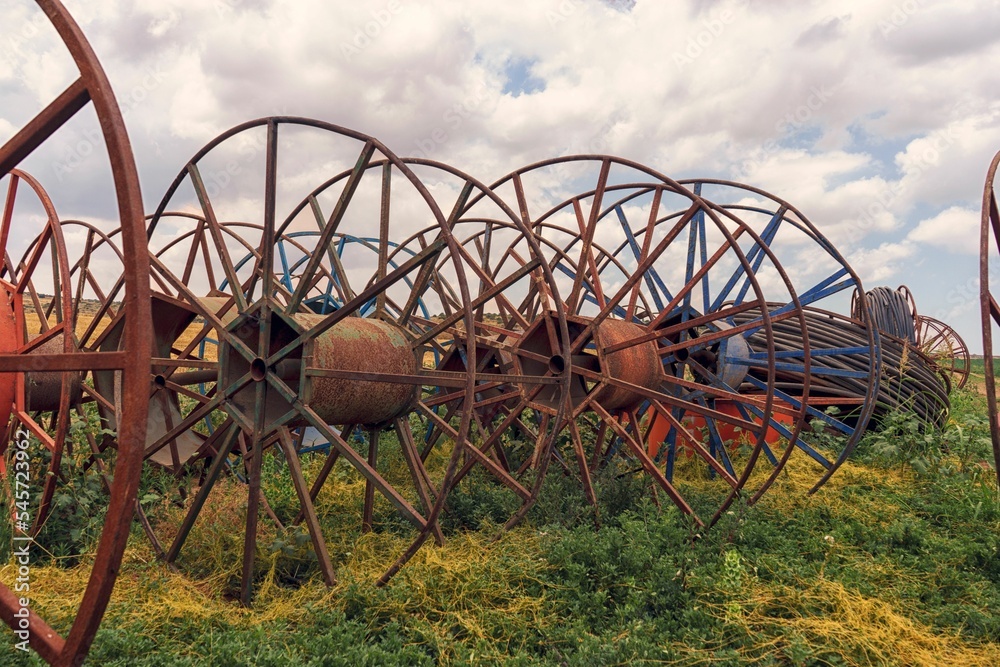 Irrigation hose reels at Ha'Ella valley, Israel Stock Photo | Adobe Stock