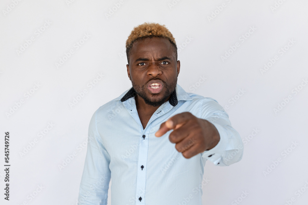 Portrait of angry African American man pointing at camera. Furious ...