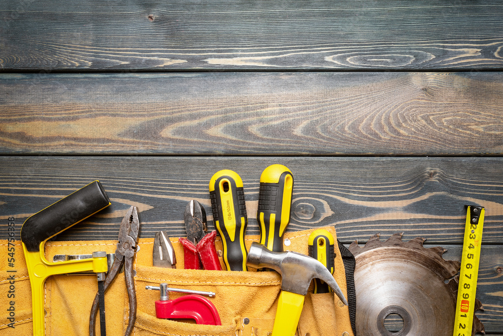 Meter, wooden planks, construction tools and circular saw blade on the ...