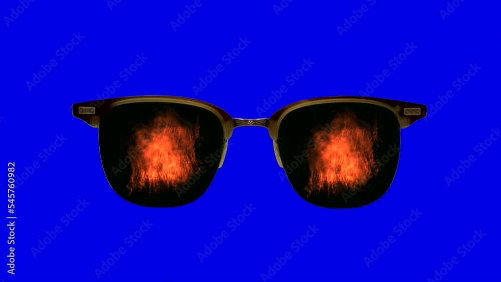 Sunglasses with reflection of explosion and flame on blue screen ...
